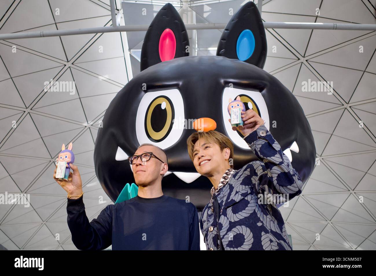Hong Kong artist Kasing Lung and singer Hins Cheung posing photo at the ...