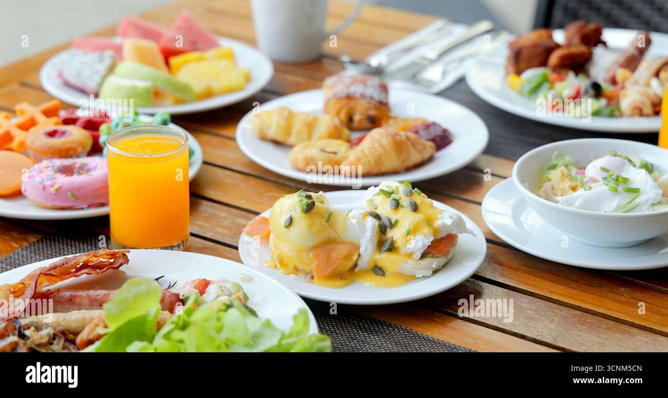 Luxurious breakfast spread featuring fresh fruits, pastries, eggs Stock ...