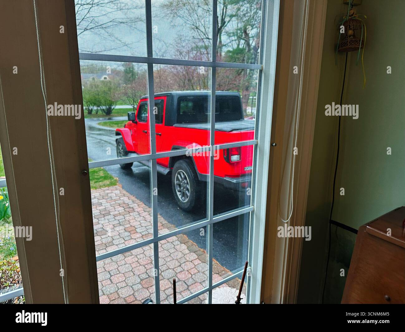 Jenkintown, Pennsylvania, USA - April 25, 2025: Red Jeep parked outside ...