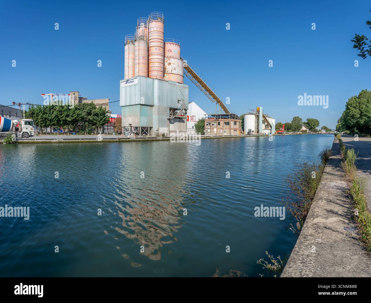 Paris, France - 09 07 2025: Saint-Denis Canal. View of CEMEX Materials ...