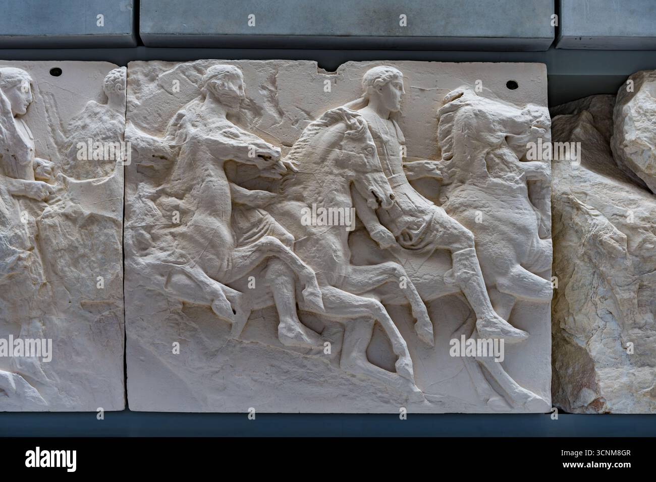 Detail of parthenon, South frieze. Riders galloping wearing a cuirass ...