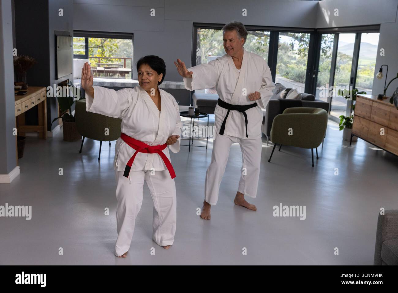Senior woman performing karate forward hi-res stock photography and ...