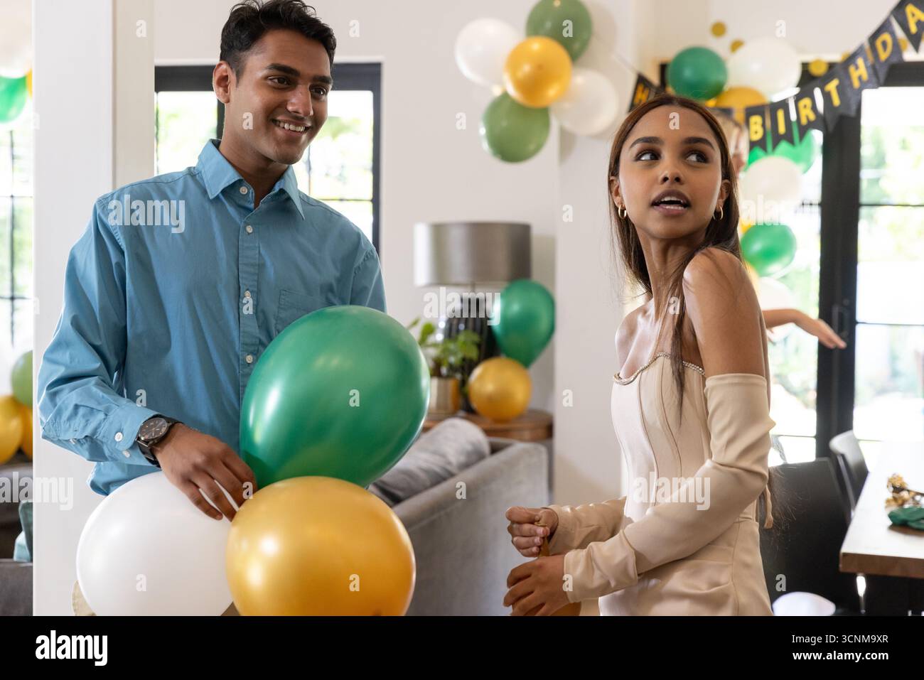 Diverse couple arranging table birthday hi-res stock photography and ...