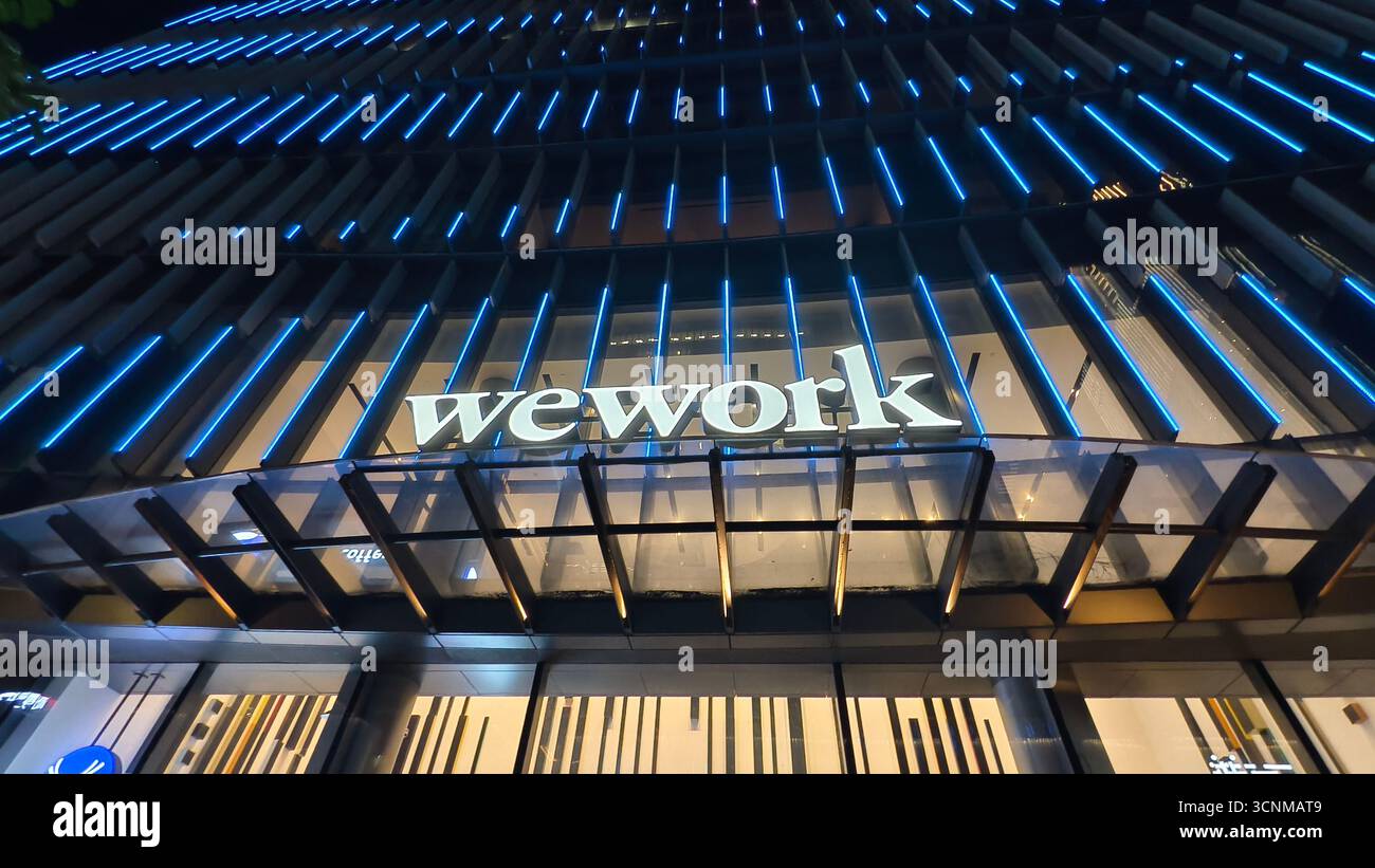 SHANGHAI, CHINA - SEPTEMBER 21, 2025 - Night view of WEWORK Building in ...