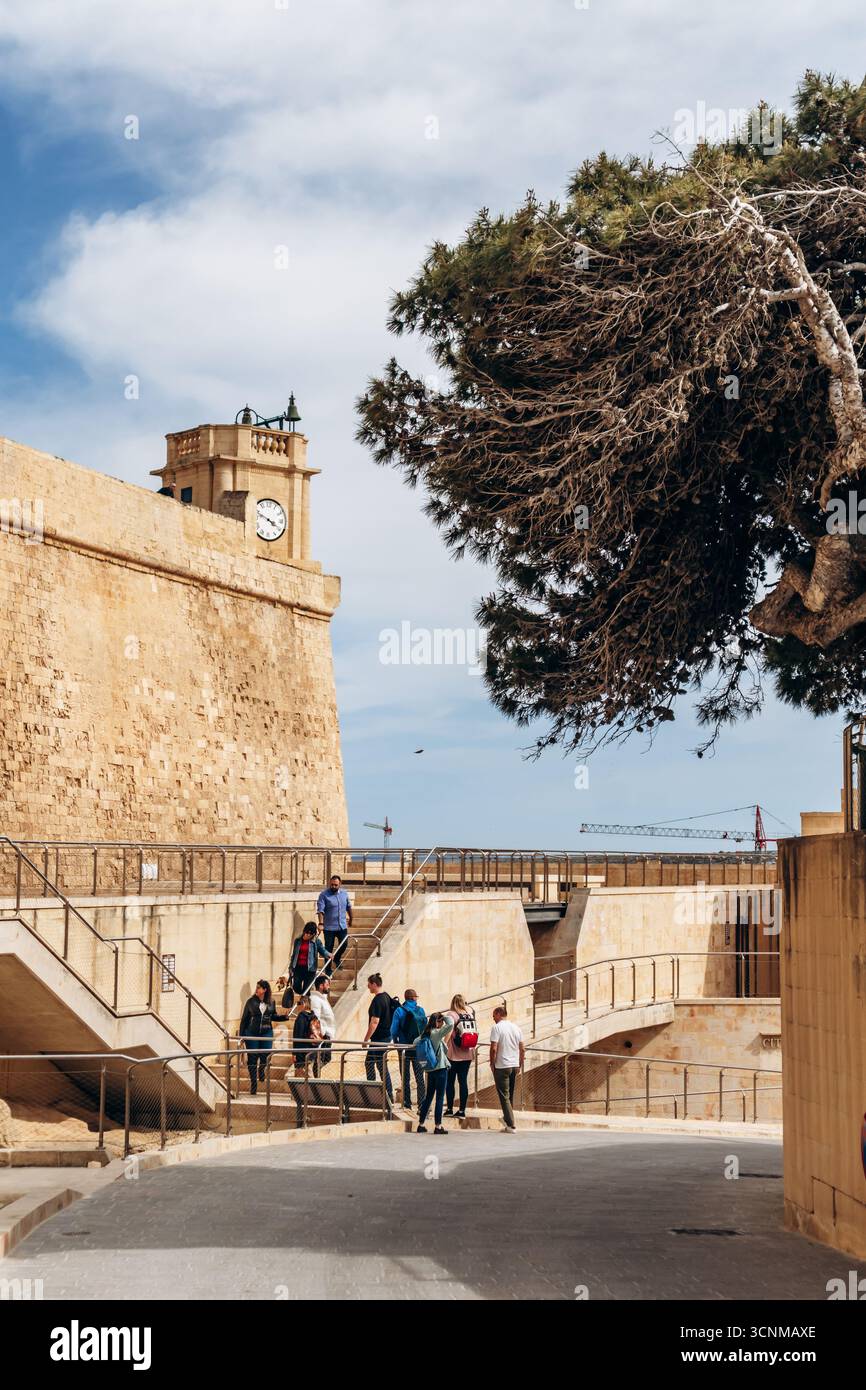 Gozo, Malta – April 12, 2025: Visitors explore the outer ramparts and ...