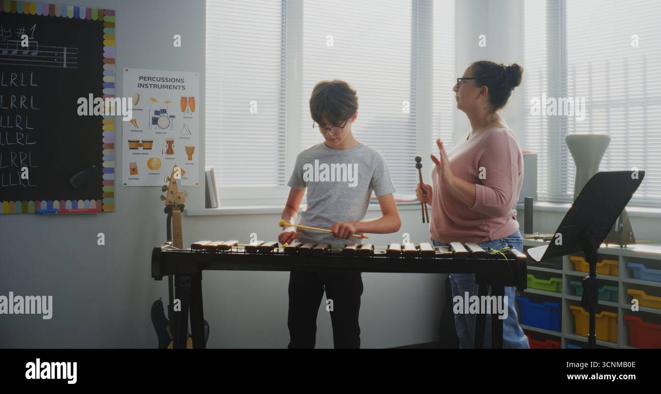 Primary School Boy Practicing Xylophone in Modern Music Class, Dreaming ...
