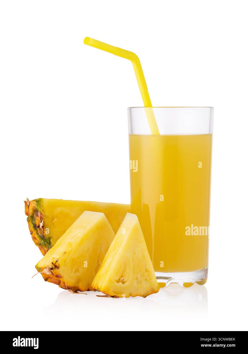 A glass of pineapple juice without ice and pineapple pieces lying ...
