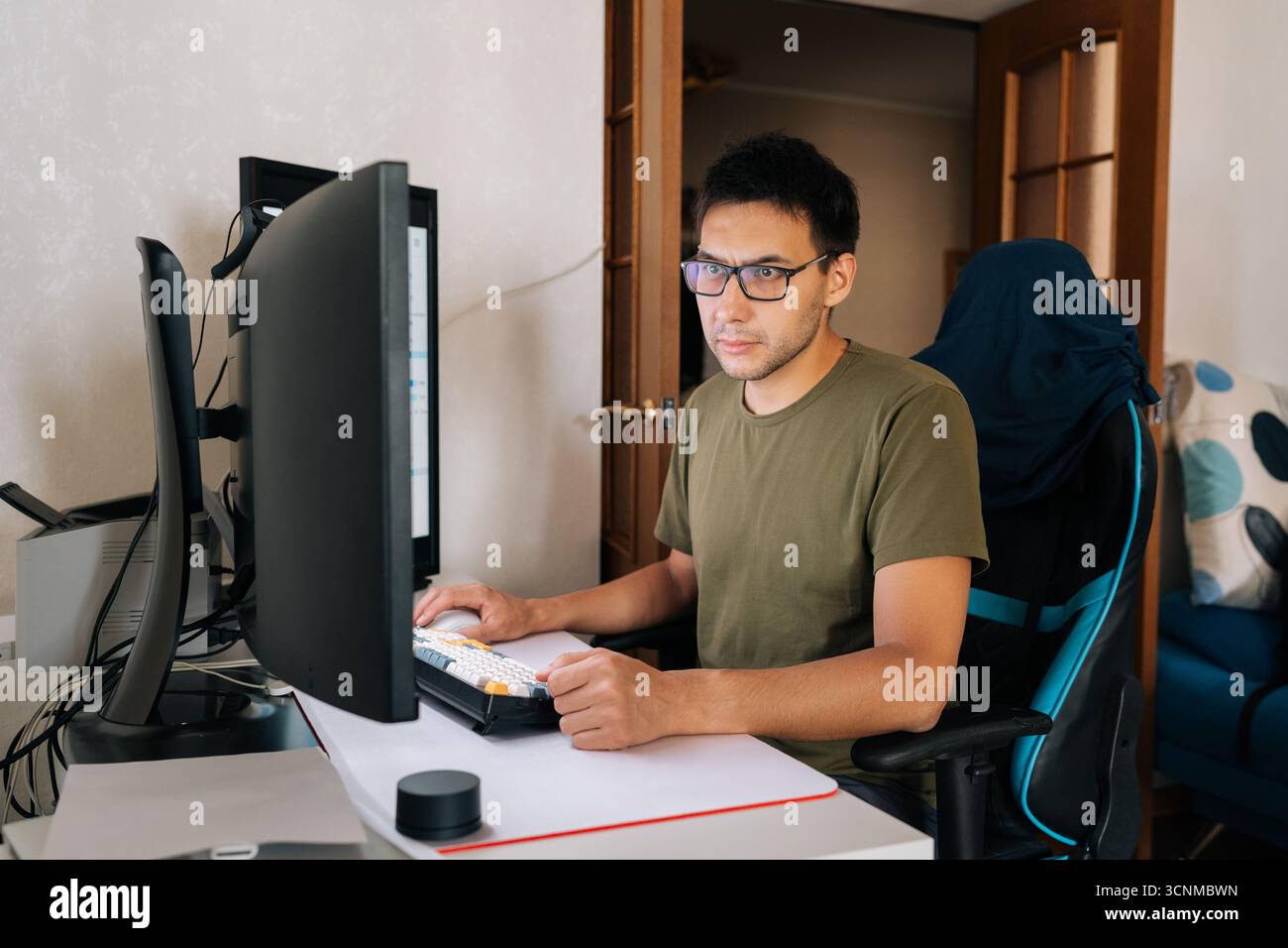 Focused programmer male typing on mechanical keyboard, working remotely ...