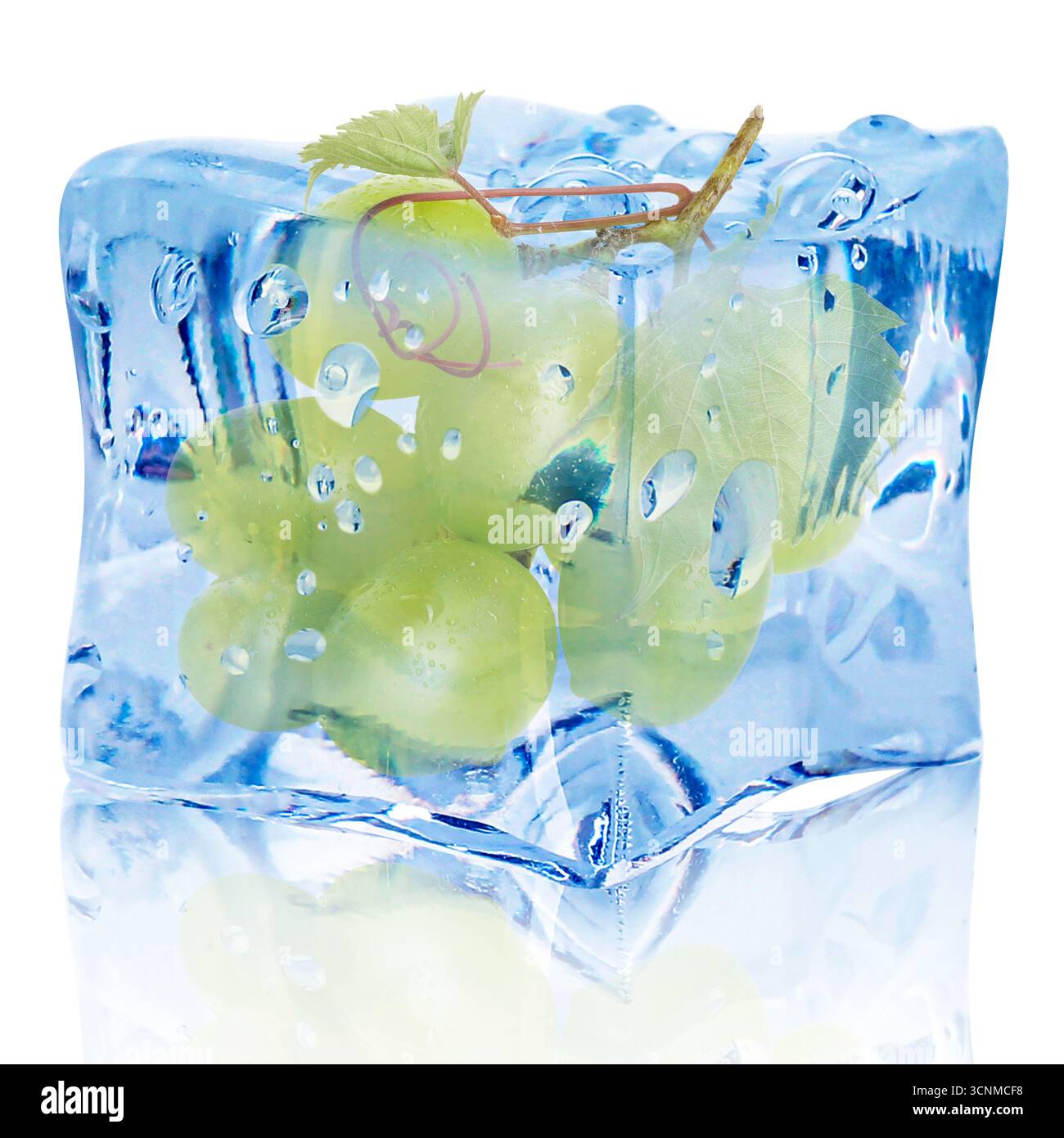 Fresh grapes inside ice cube on white background Stock Photo - Alamy