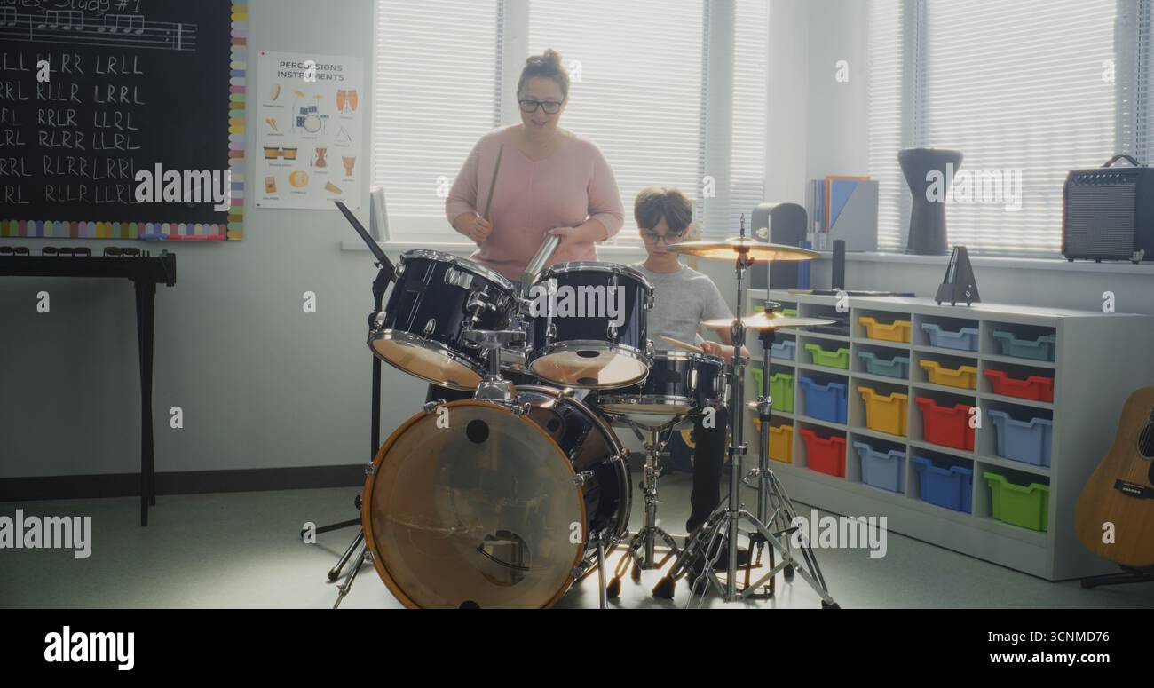 Primary School Boy Practicing Drums in Modern Music Class, Dreaming to ...