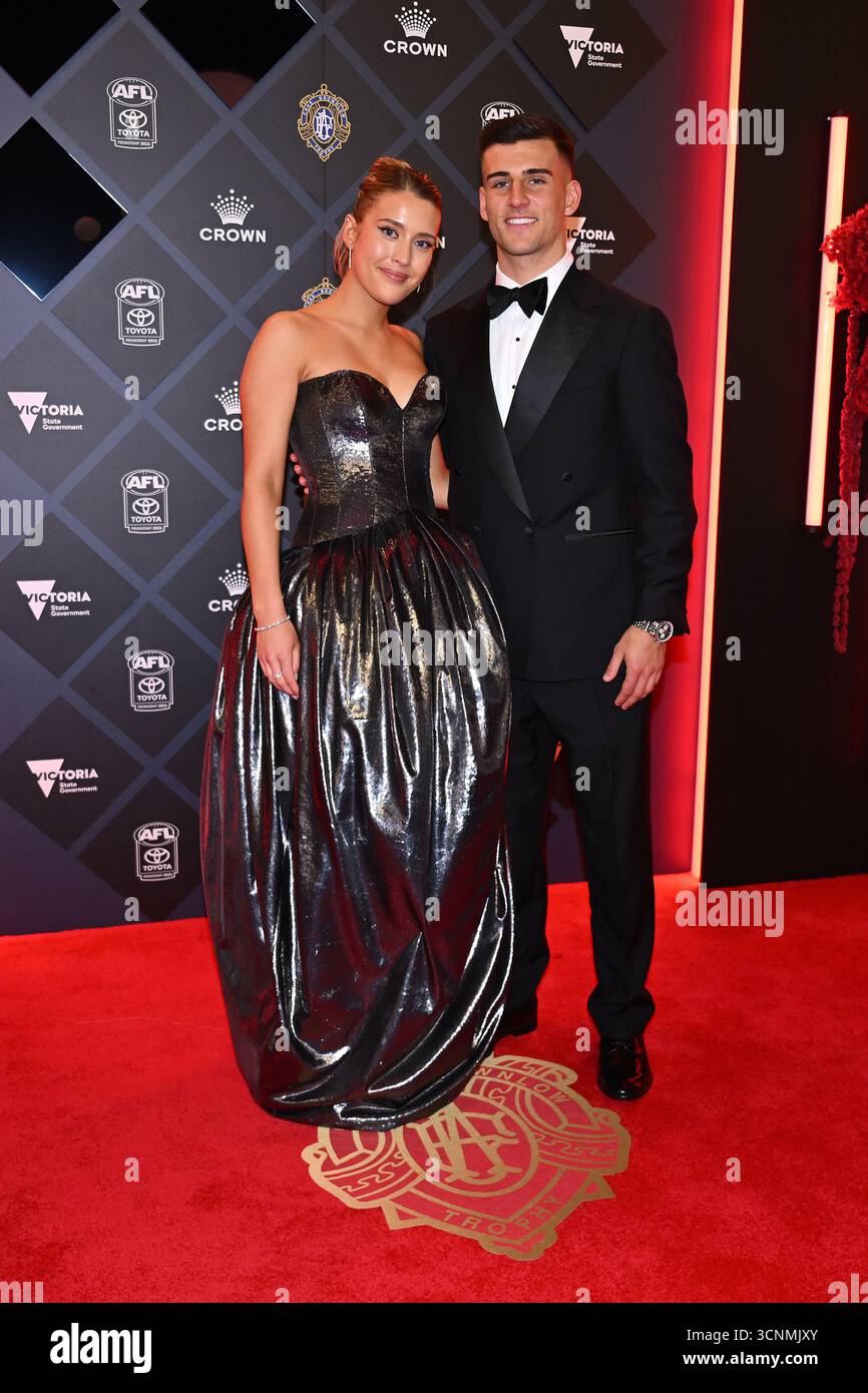 Nick Daicos of Collingwood (right) and Arlette Amor pose for a photo ...