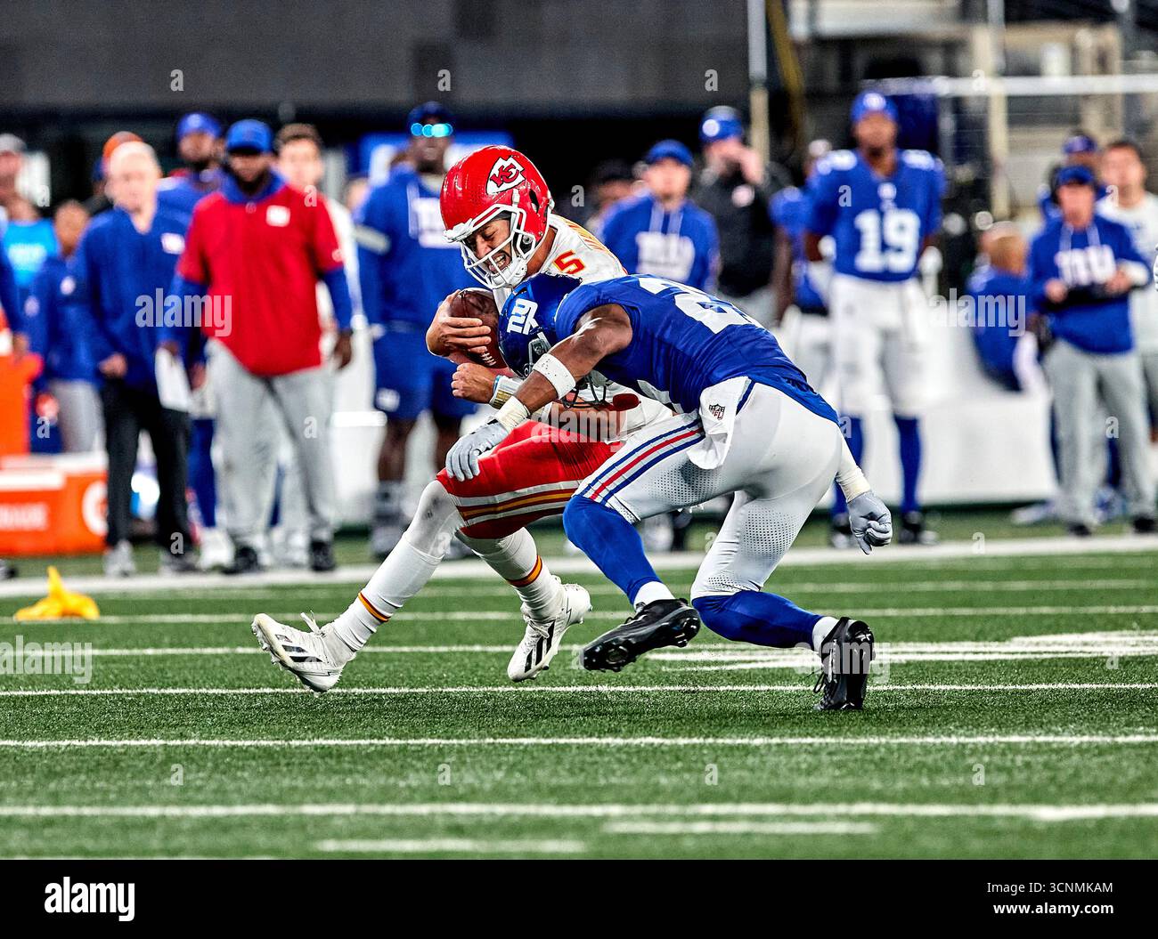 Kansas City Chiefs quarterback Patrick Mahomes (15) takes hit from New ...