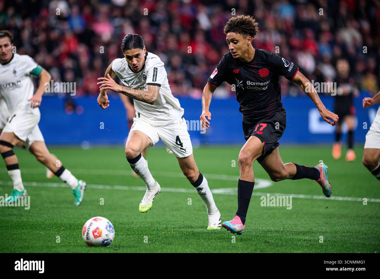 LEVERKUSEN, GERMANY - 21 SEPTEMBER, 2025: Elise Ben Seghir, Kevin Diks - The Bundesliga match ...