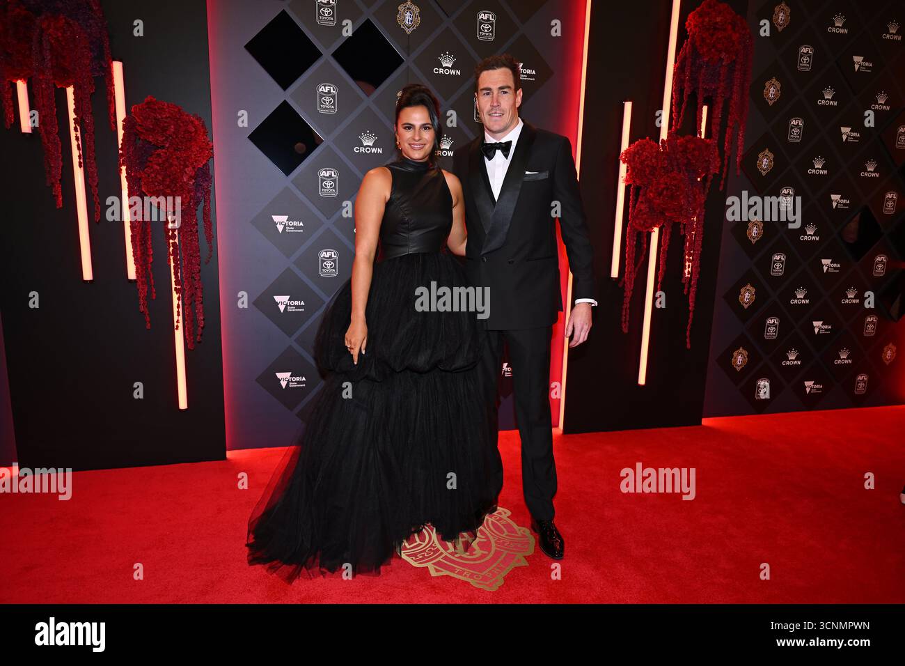 Jeremy Cameron of Geelong (right) and ndiana Putra-Cameron pose for a ...