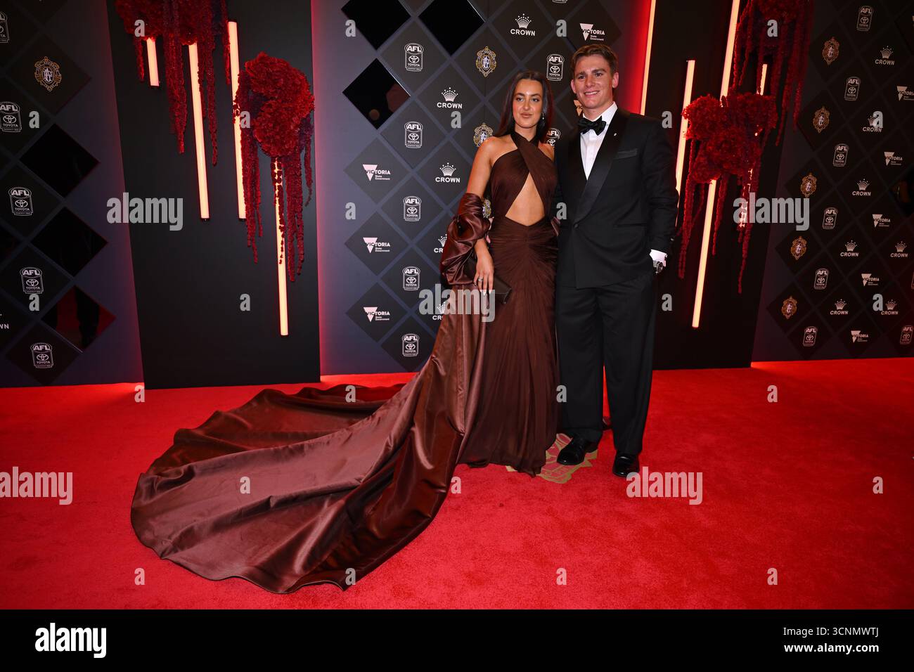 Caleb Serong of the Dockers (right) and fiancé Chloe Furnari pose for a ...