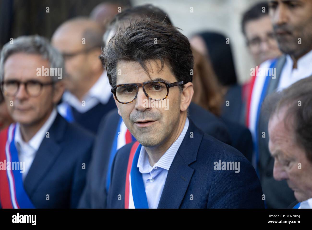 Mayor of Saint Denis Mathieu Hanotin speaks to the press after a flag ...