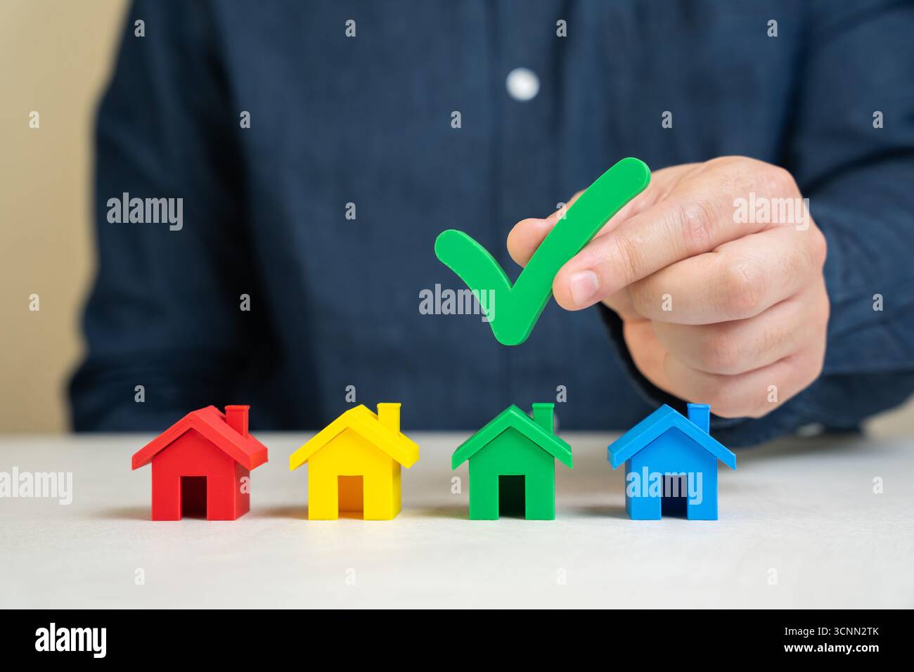 Man selects a house with a tick. The best choice of housing ...