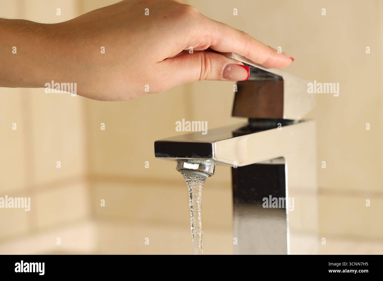 Water saving concept. Woman turning tap on indoors, closeup Stock Photo ...