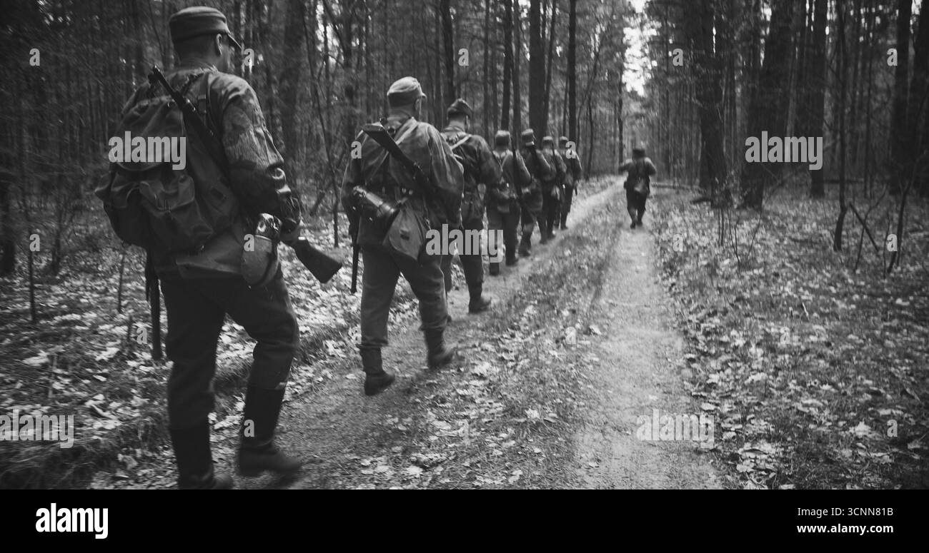 Group Of Reenactors Dressed As German Infantry Soldiers Marching By ...