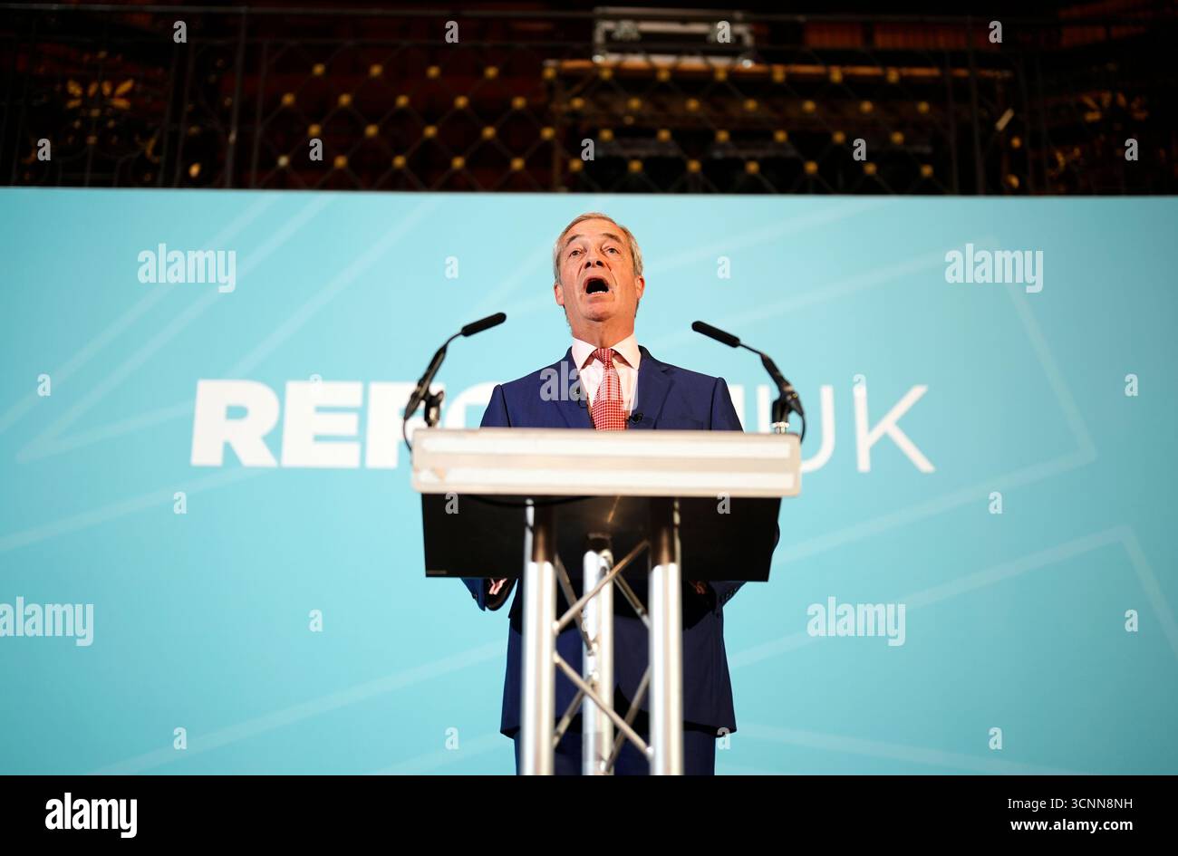 Party leader Nigel Farage speaking during a Reform UK press conference ...