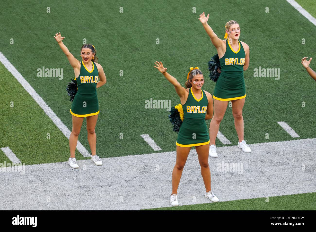 WACO, TX - SEPTEMBER 20: Baylor cheerleaders hold up the Baylor Claw ...