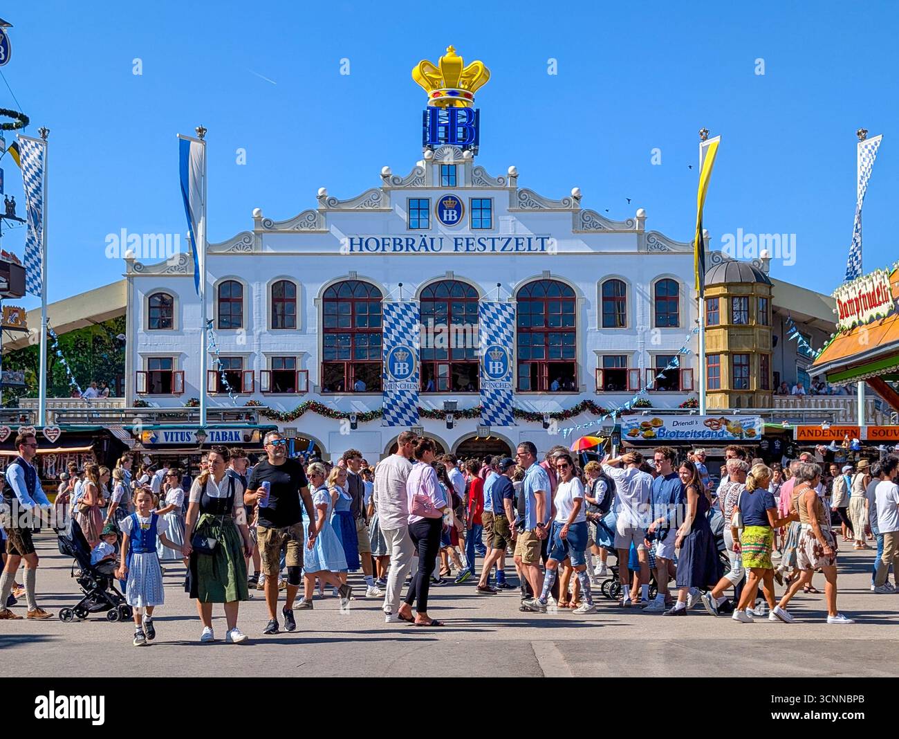 Crowds gather in front of the Hofbraeu Festzelt beer tent at ...