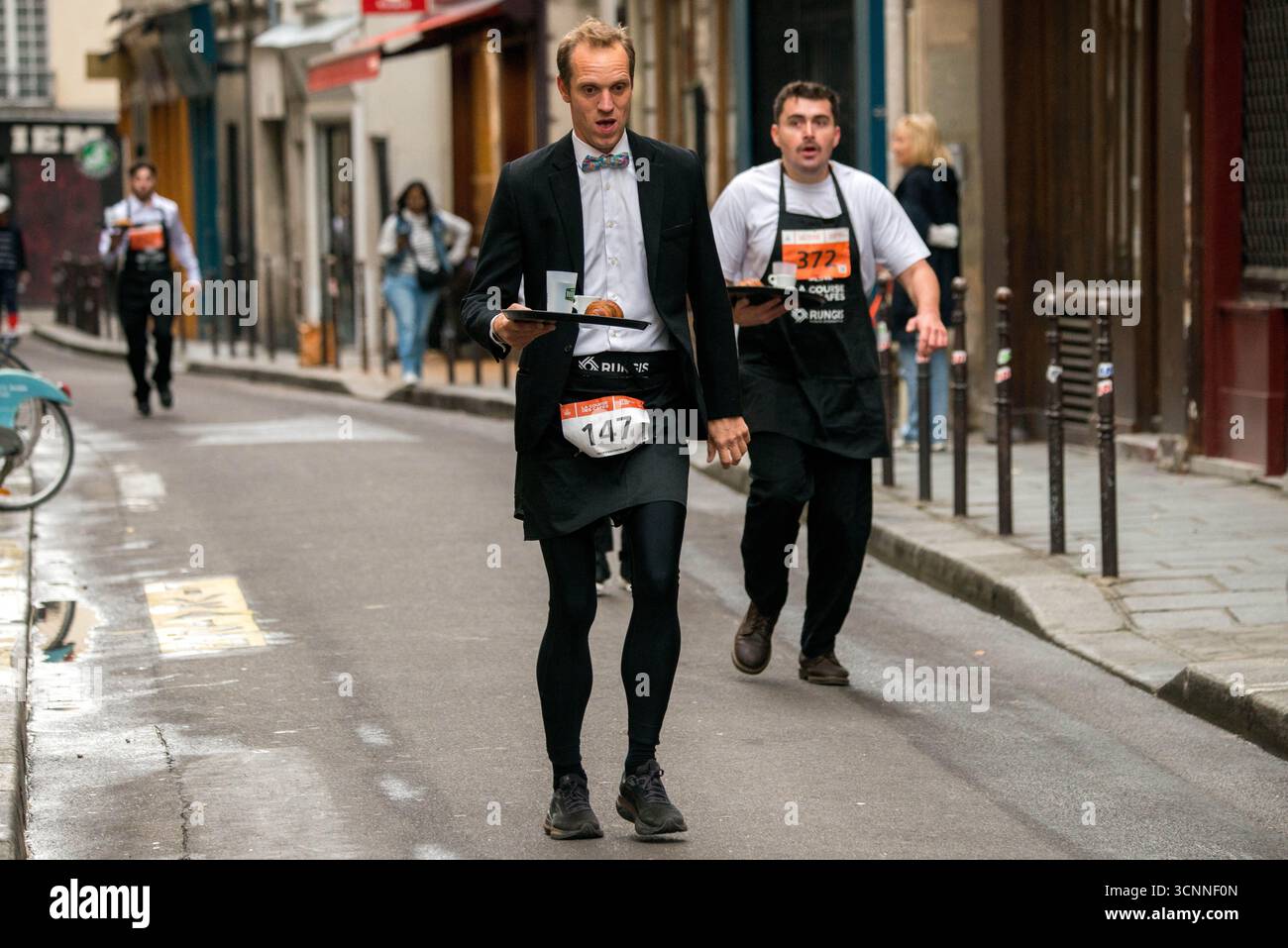 Participants take part in the traditional Waiters Race (Course des ...