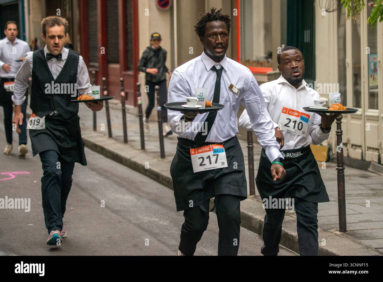 Participants take part in the traditional Waiters Race (Course des ...
