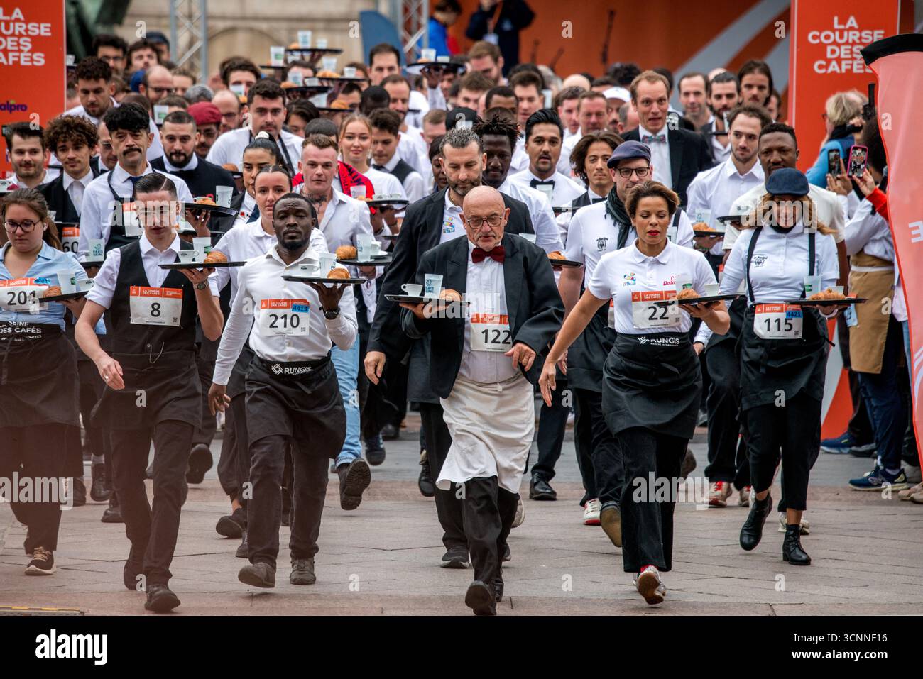 Participants take part in the traditional Waiters Race (Course des ...