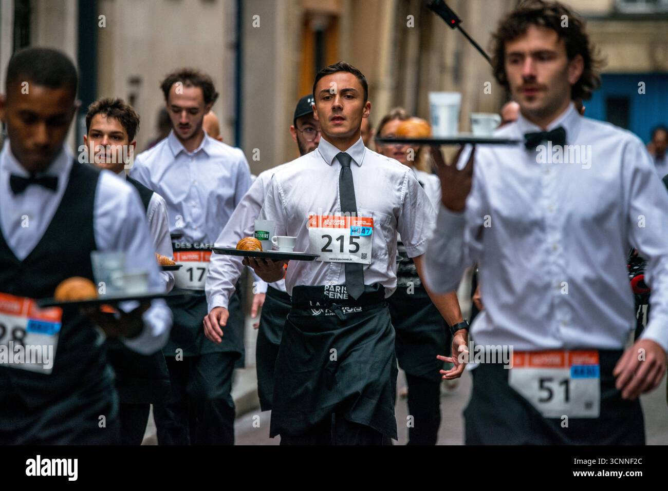 Participants take part in the traditional Waiters Race (Course des ...
