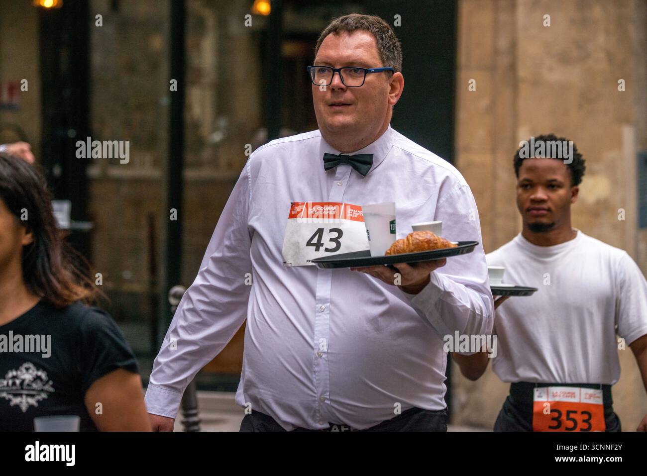Participants take part in the traditional Waiters Race (Course des ...