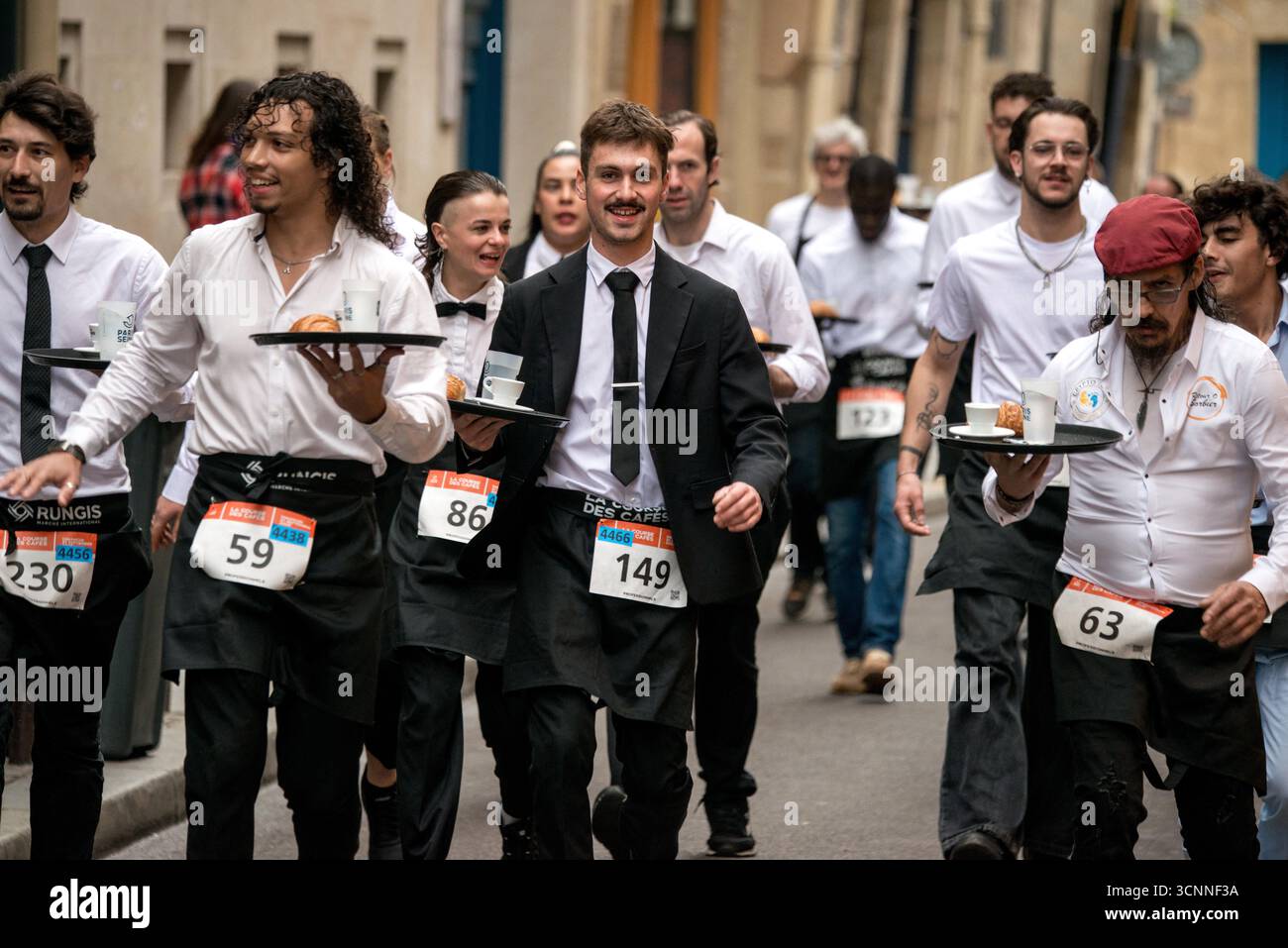Participants take part in the traditional Waiters Race (Course des ...