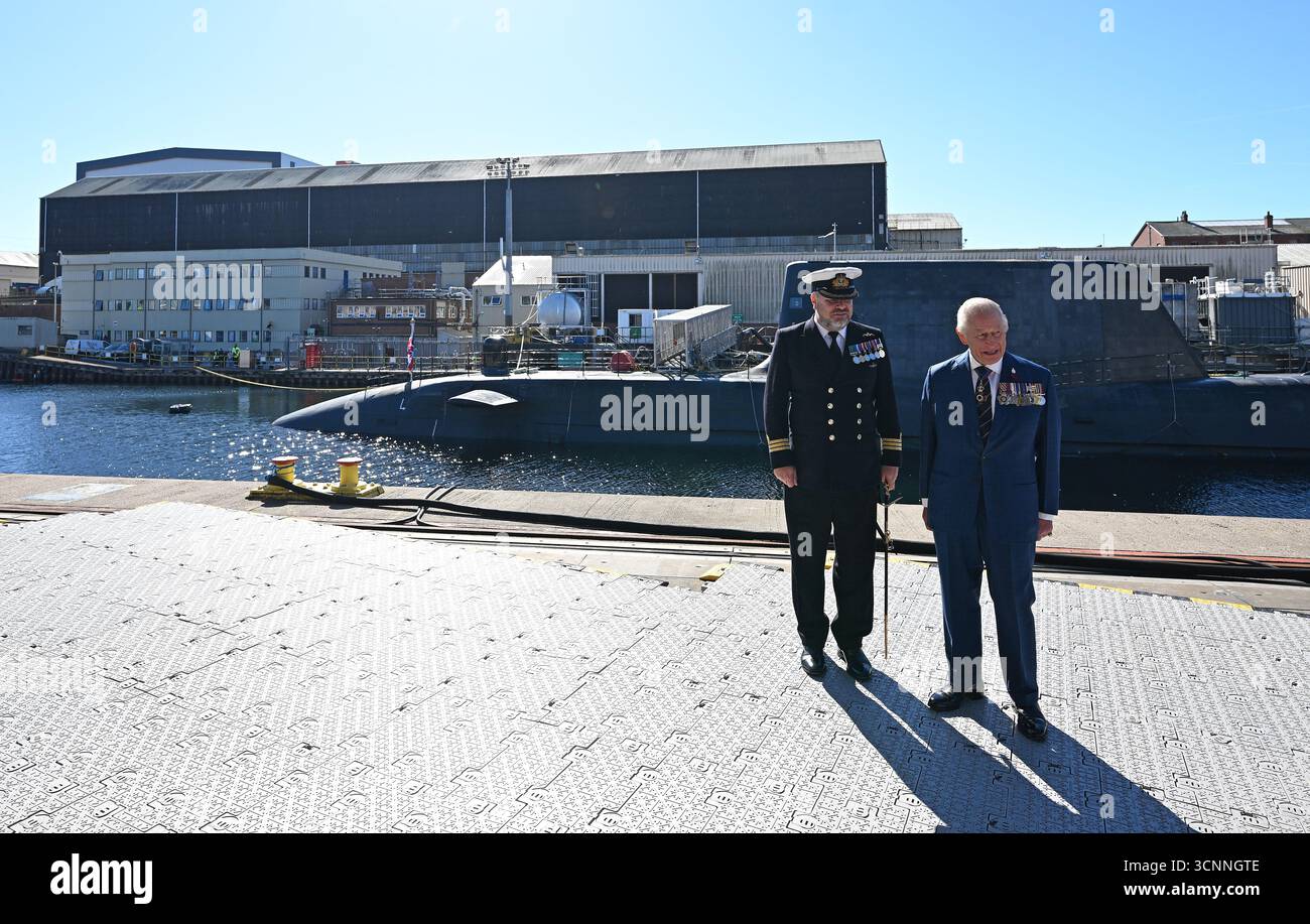 King Charles III (right) talks with Commanding Officer David Crosby ...