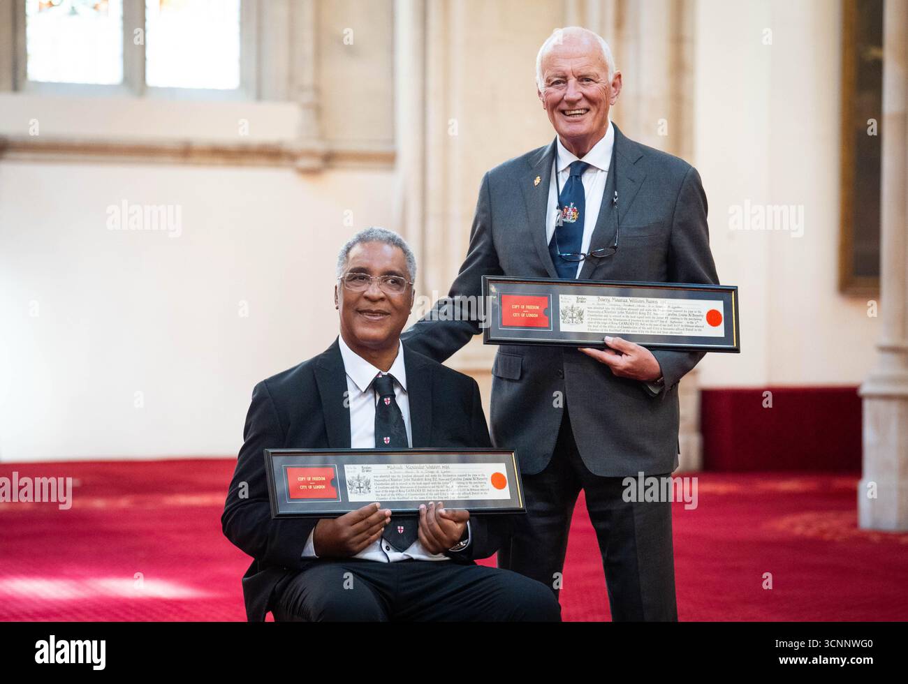 Boxer Michael Watson and boxing promoter Barry Hearn pose after they ...