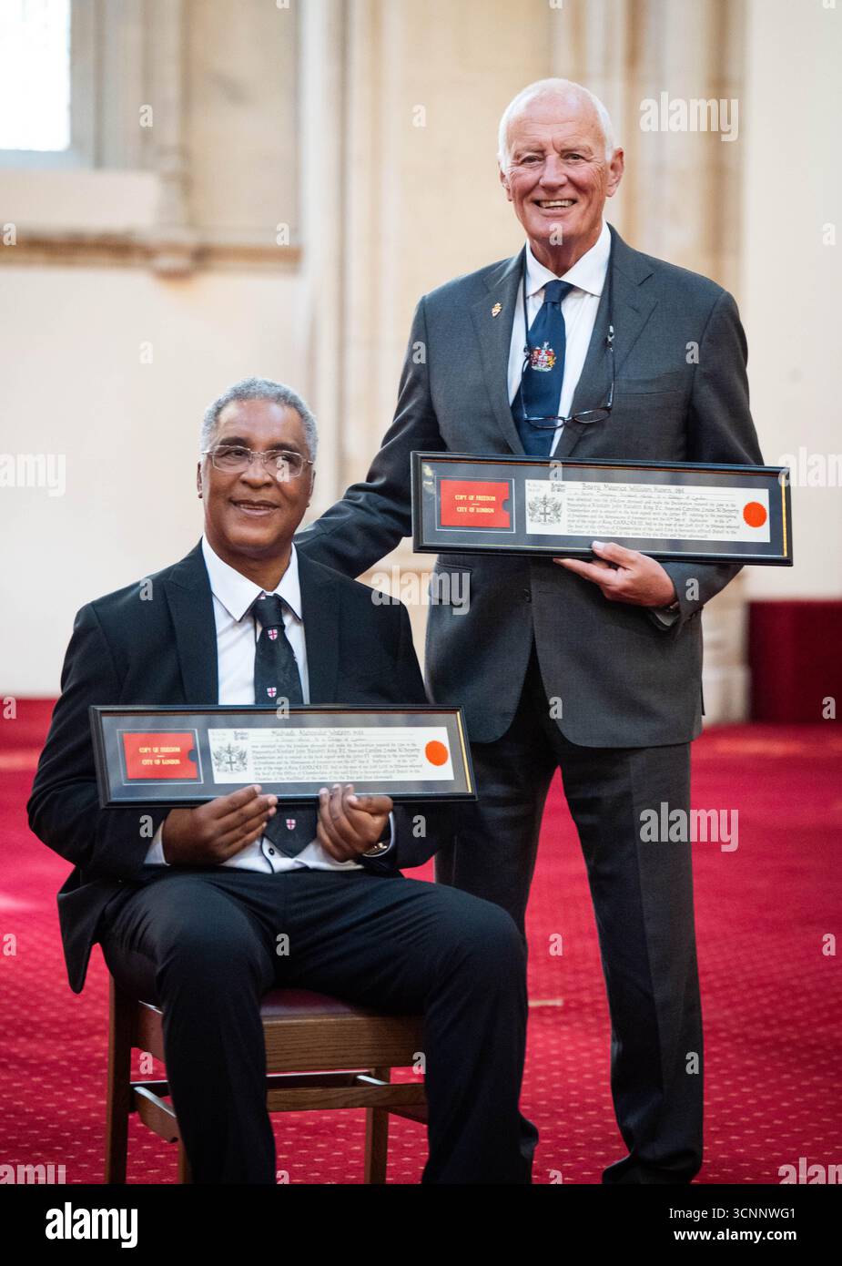 Boxer Michael Watson and boxing promoter Barry Hearn pose after they ...