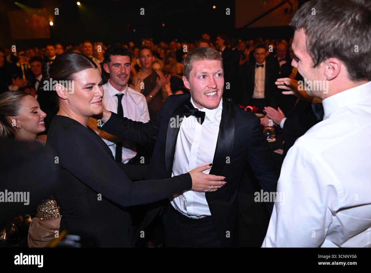 Matt Rowell of the Suns (centre) celebrates winning the 2025 Brownlow ...