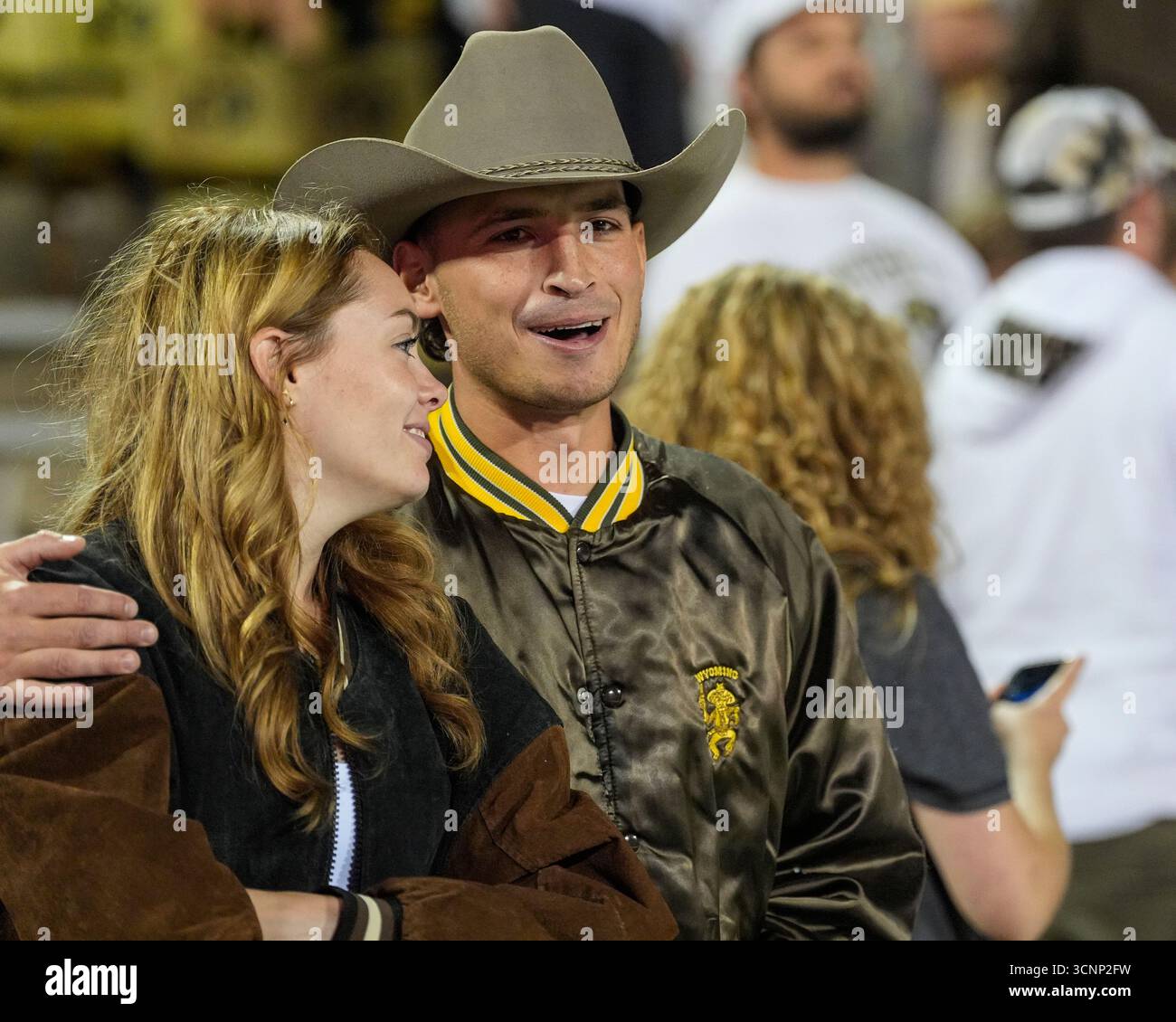September 20, 2025: A couple of Wyoming Cowboy fans share a moment ...