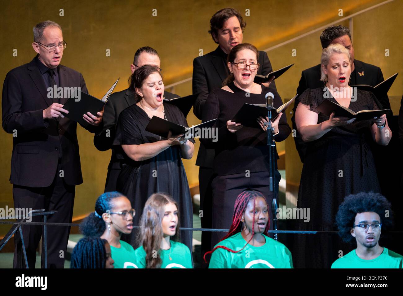 Members of the Metropolitan Opera chorus sing in front of the 80th ...