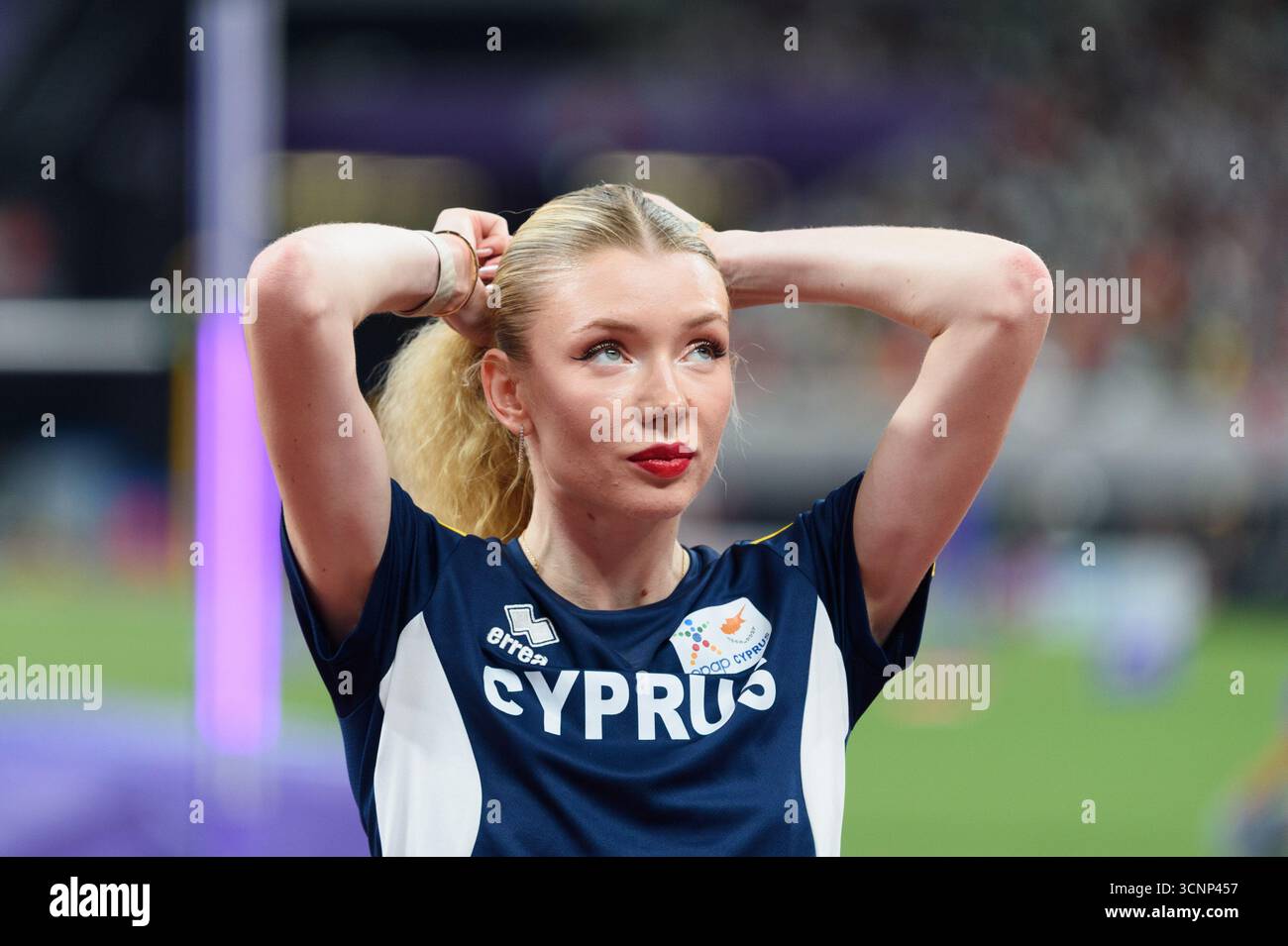 Headshot, portrait of Elena Kulichenko (Cyprus) makes some handwritten ...