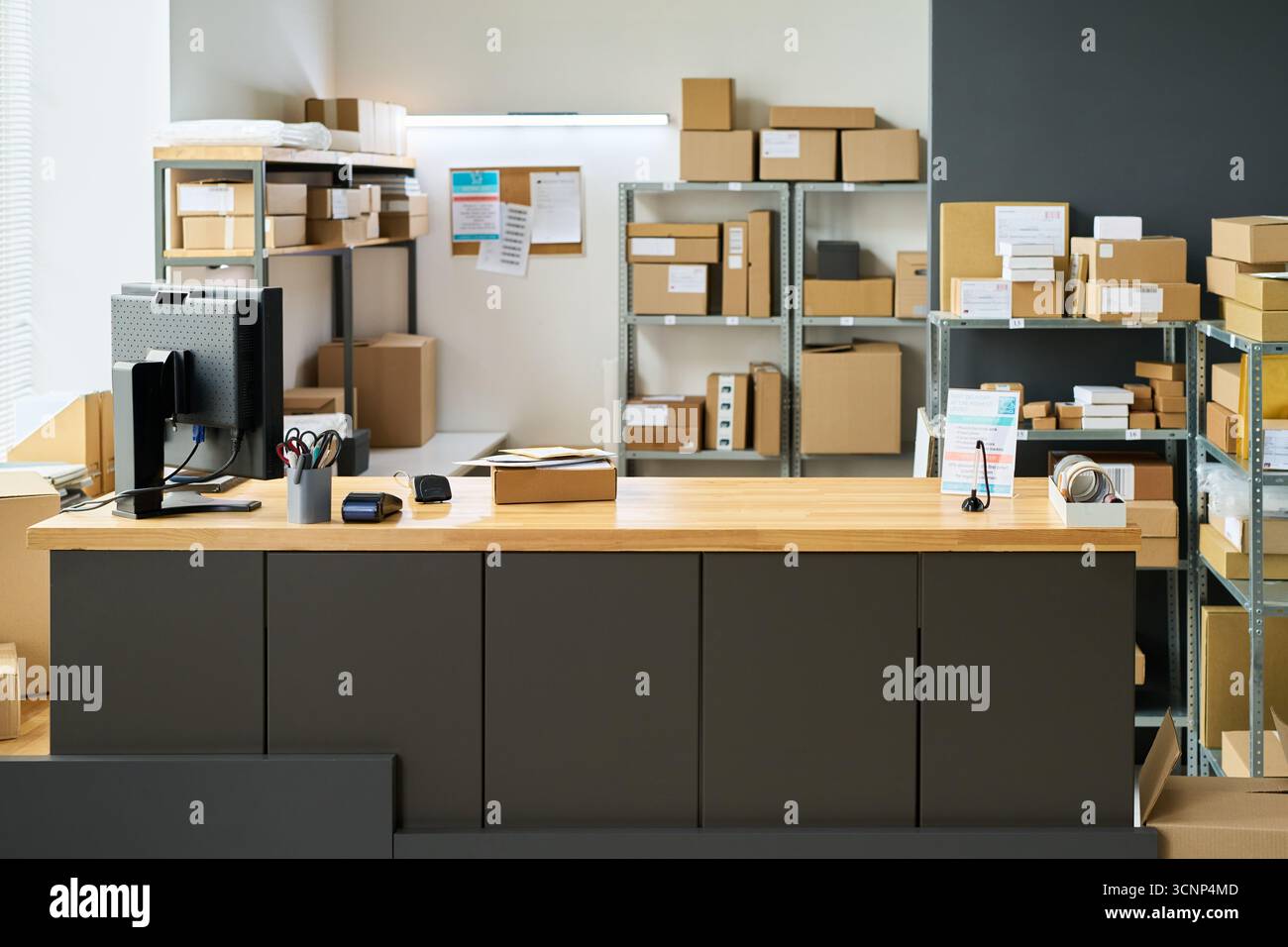 Empty modern shipping office showing wooden counter with desktop ...
