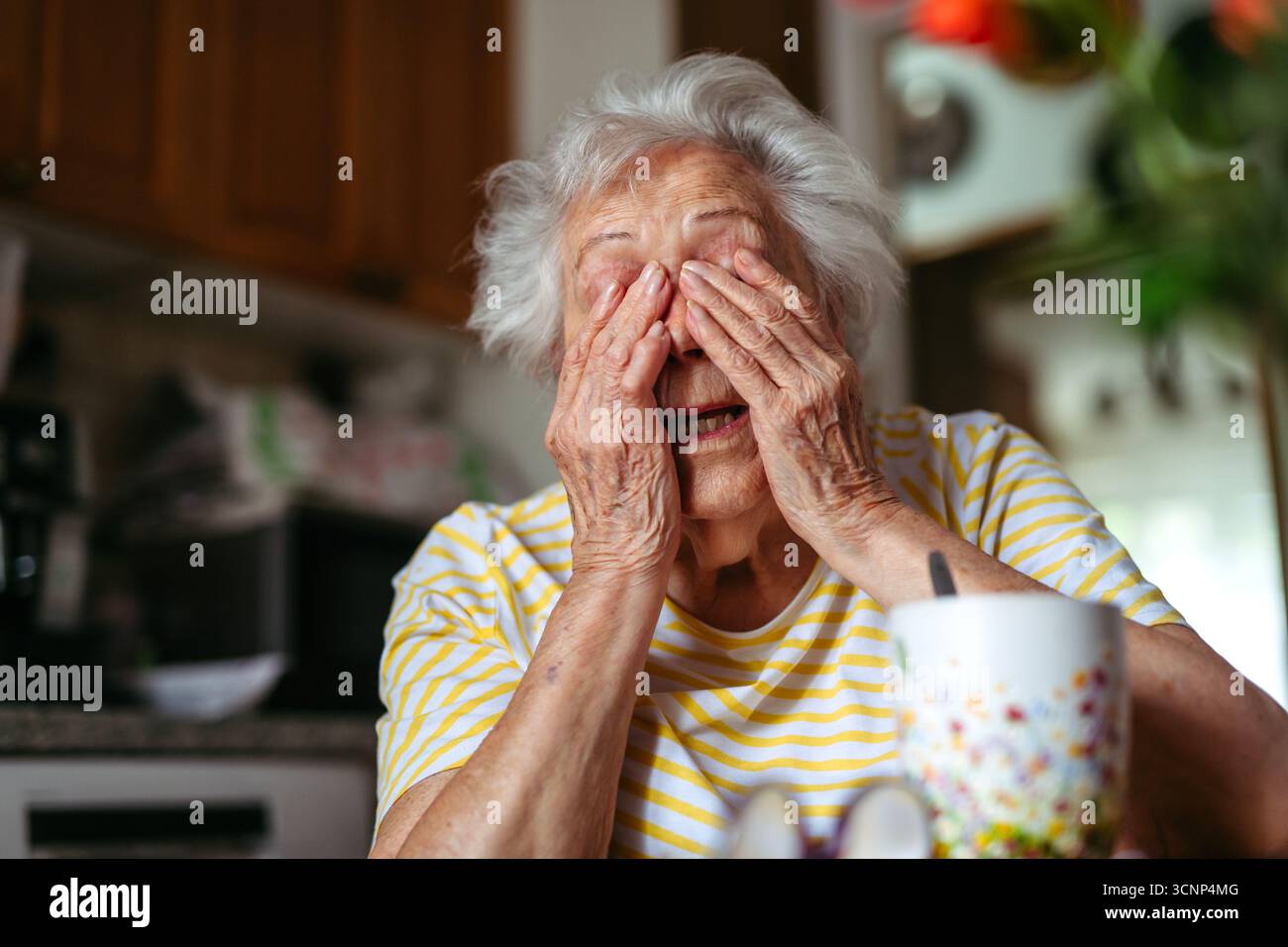 Portrait of worried senior woman crying in kitchen Stock Photo - Alamy
