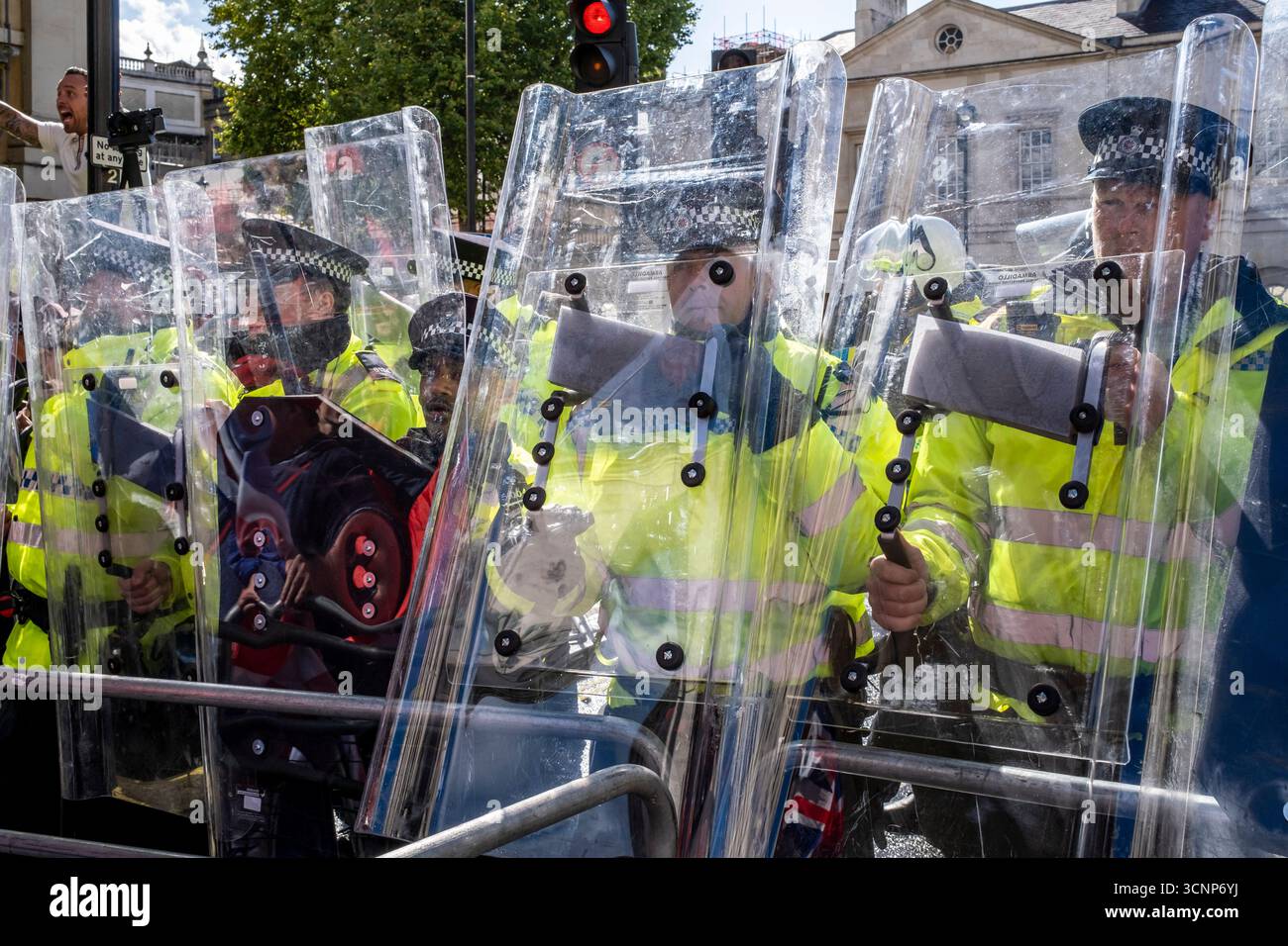 Metropolitan Police Officers Stand Behind Riot Shields Preventing ...