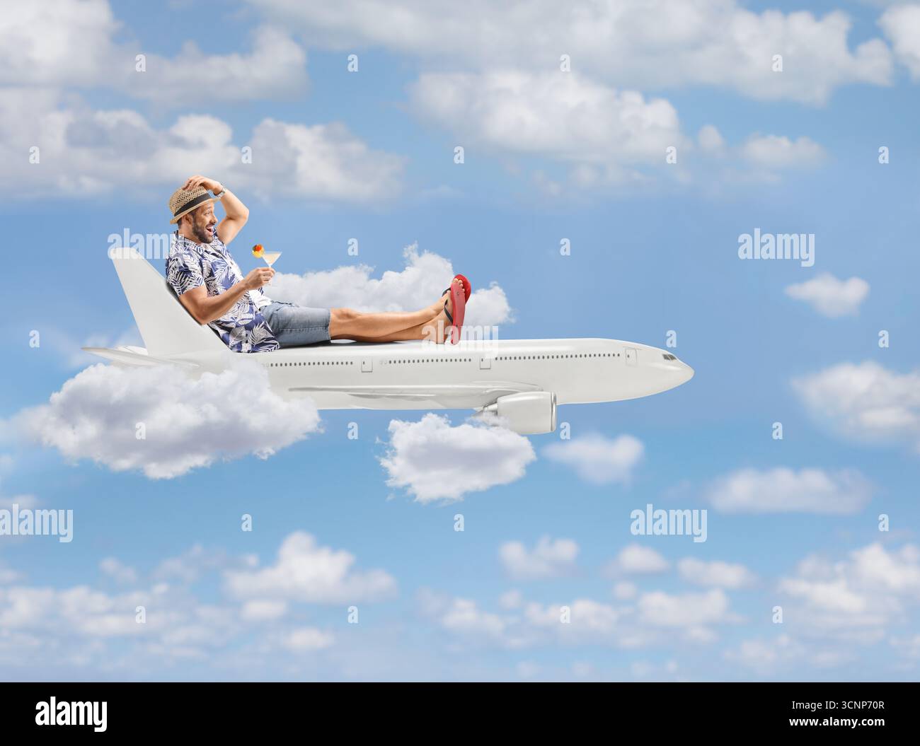 Male tourist sitting on top of an airplane and flying in the sky Stock ...
