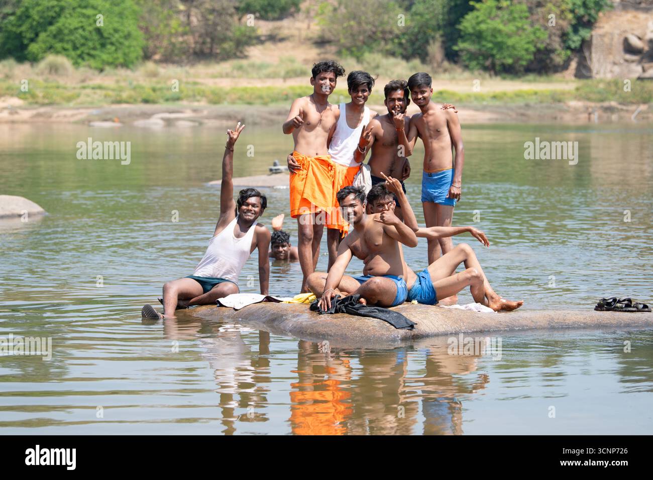 Group Of Young Indian Men Taking A Bath A Tungabhadra River In Hampi ...