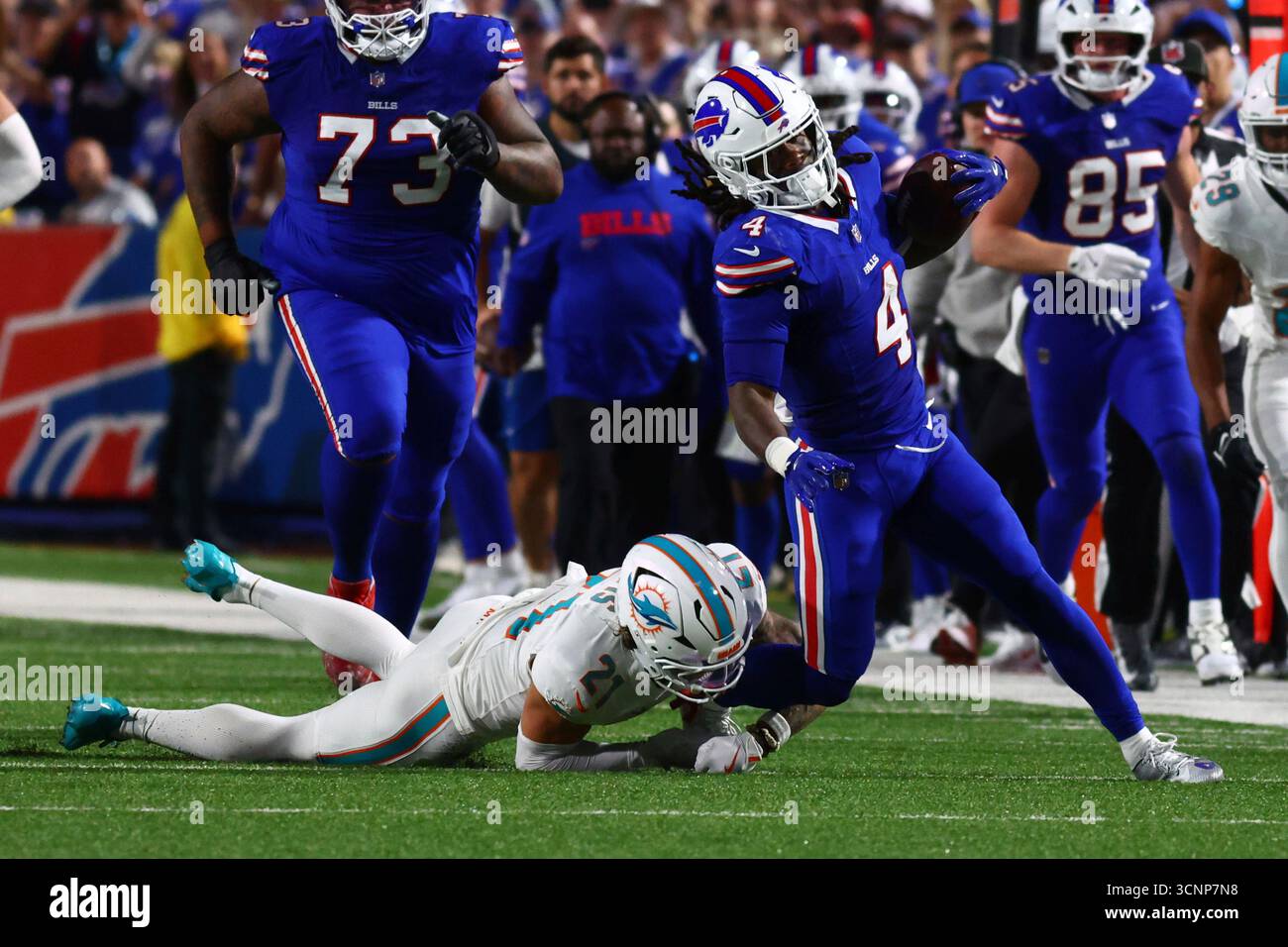Buffalo Bills running back James Cook (4) is brought down by Miami ...