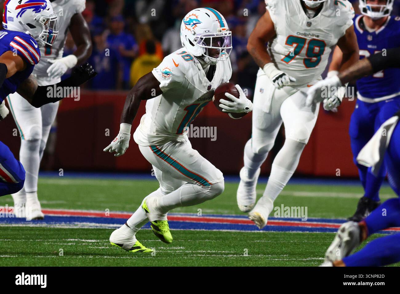 Miami Dolphins wide receiver Tyreek Hill (10) carries the ball after a ...