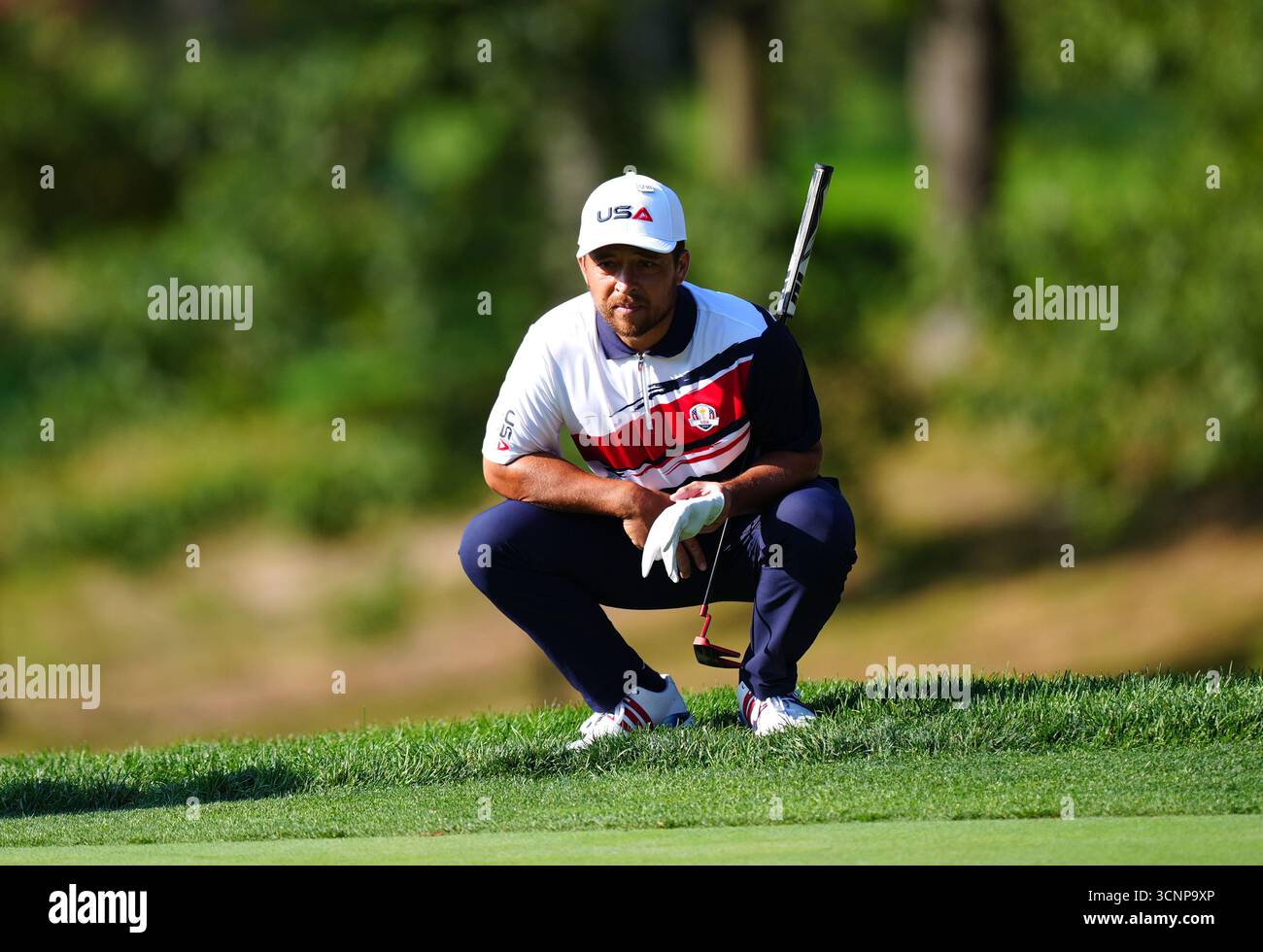 USA's Xander Schauffele lines up a putt at the Bethpage Black Course in ...