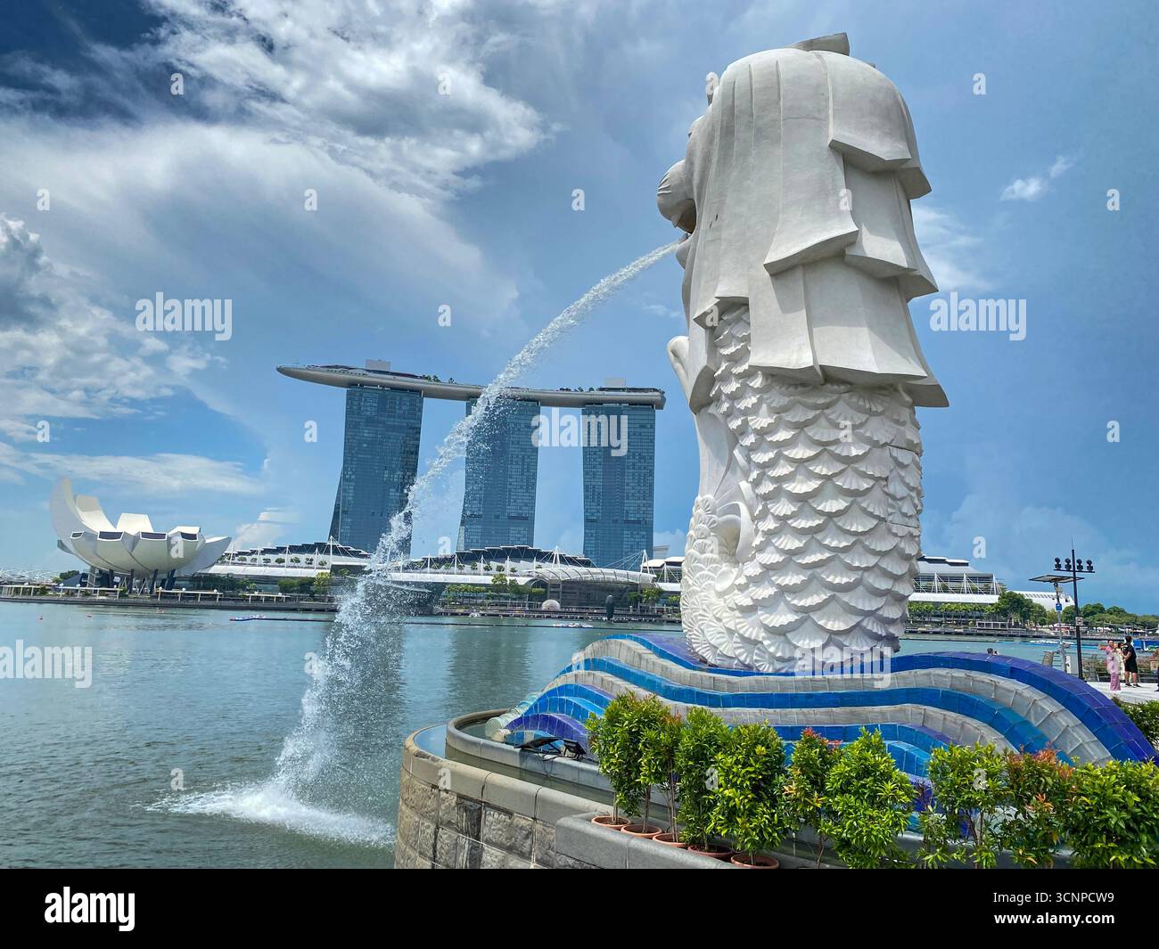 In the background is the Marina Bay Sands Hotel across Marina Bay in ...