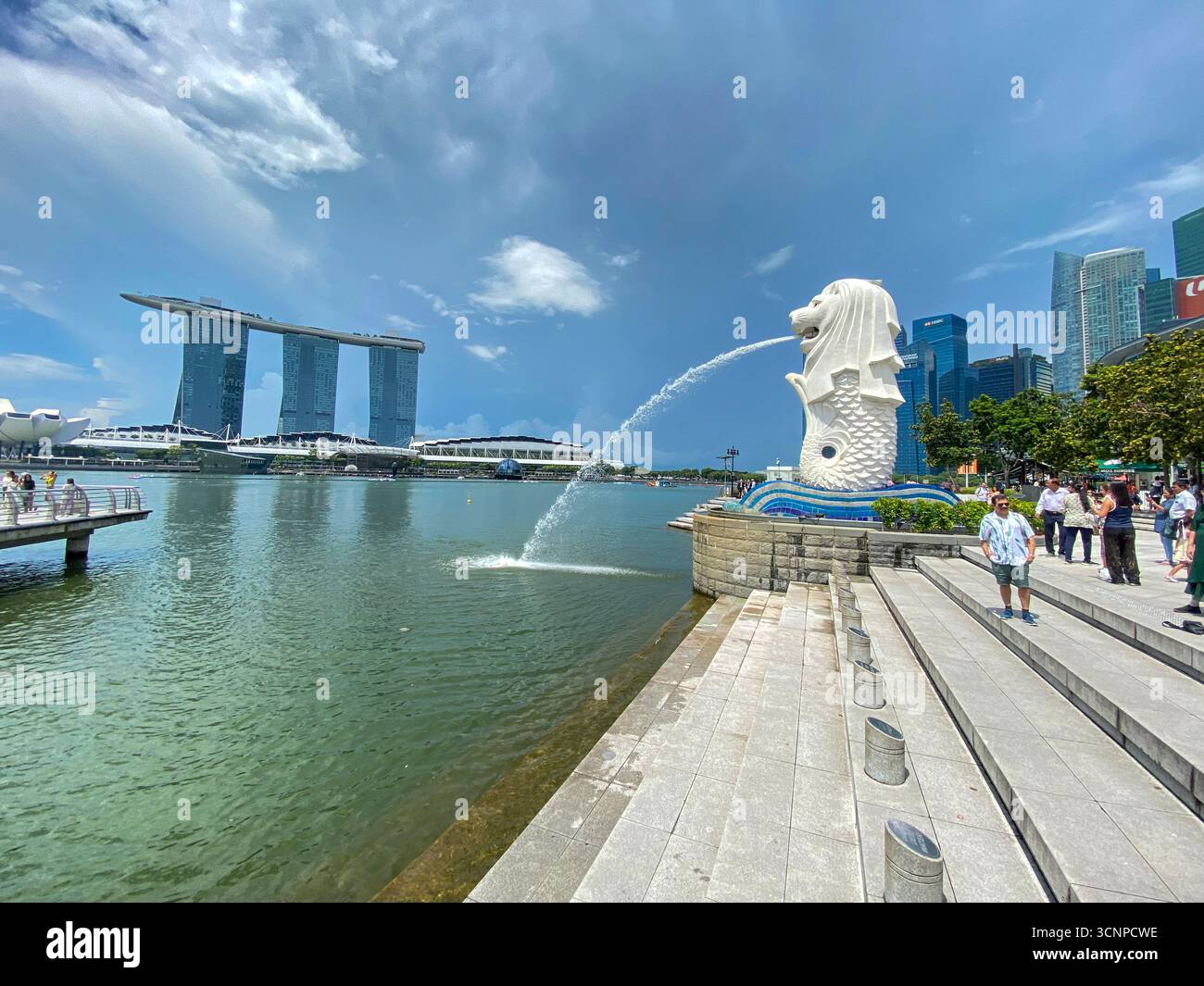 In the background is the Marina Bay Sands Hotel across Marina Bay in ...
