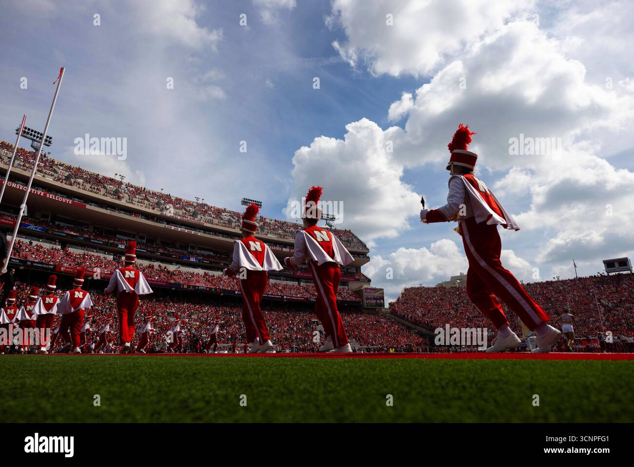 The Nebraska marching band performs before Michigan plays against ...